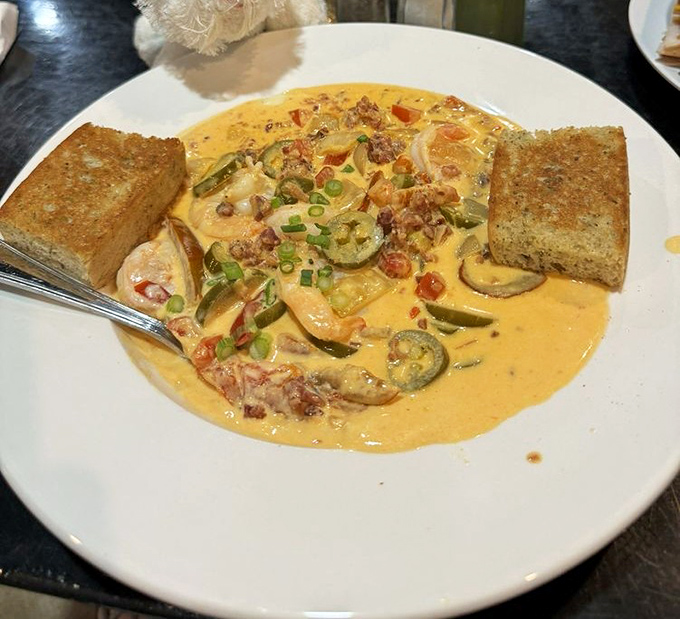 A creamy bowl of shrimp and grits that would make a Lowcountry grandmother nod in approval. Those zucchini slices aren't just garnish&mdash;they're part of the conversation.