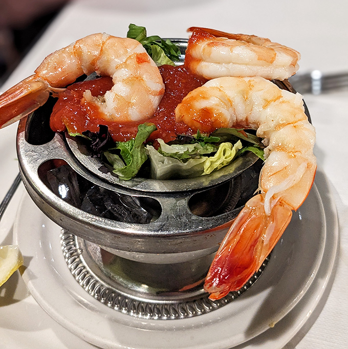 Jumbo shrimp cocktail &ndash; ocean treasures perched on the edge of their serving dish like they're about to dive into that zesty sauce.