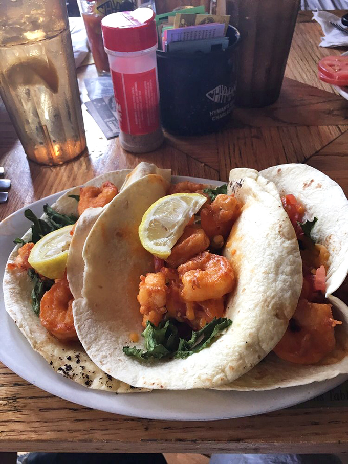 Soft tacos cradling plump shrimp and fresh greens&mdash;portable pockets of seafood joy that make utensils seem entirely optional.