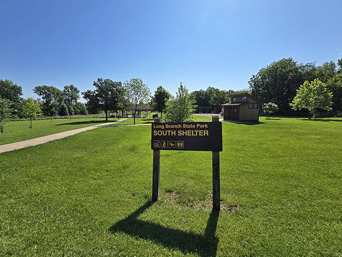 The South Shelter sign stands as a beacon of civilization amid wilderness, promising restrooms when nature calls unexpectedly.