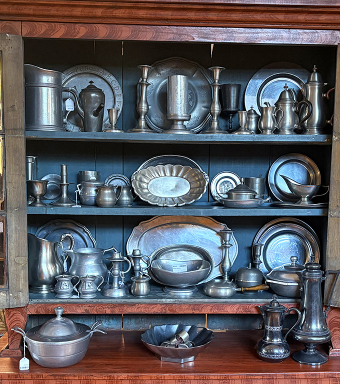 Pewter and silver treasures gleam with history. These aren't just serving pieces&mdash;they're conversation pieces waiting to grace your table.
