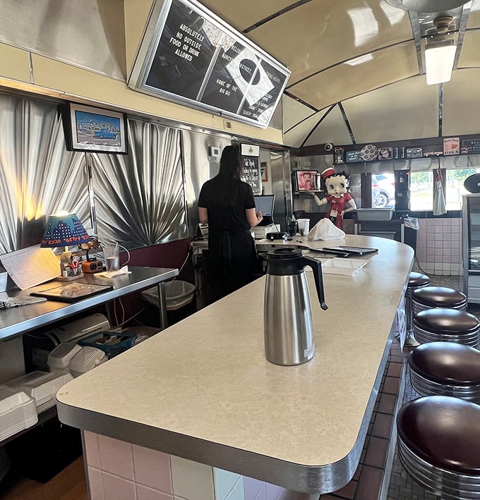 The counter experience is where diner magic happens, with coffee always at the ready and the rhythmic dance of short-order cooking just steps away.
