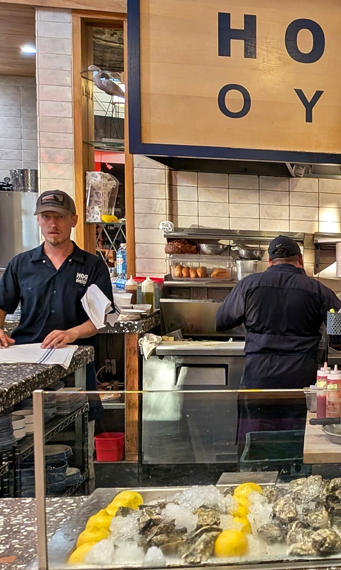 The oyster whisperers at work, treating each shell like it contains precious pearls of flavor.