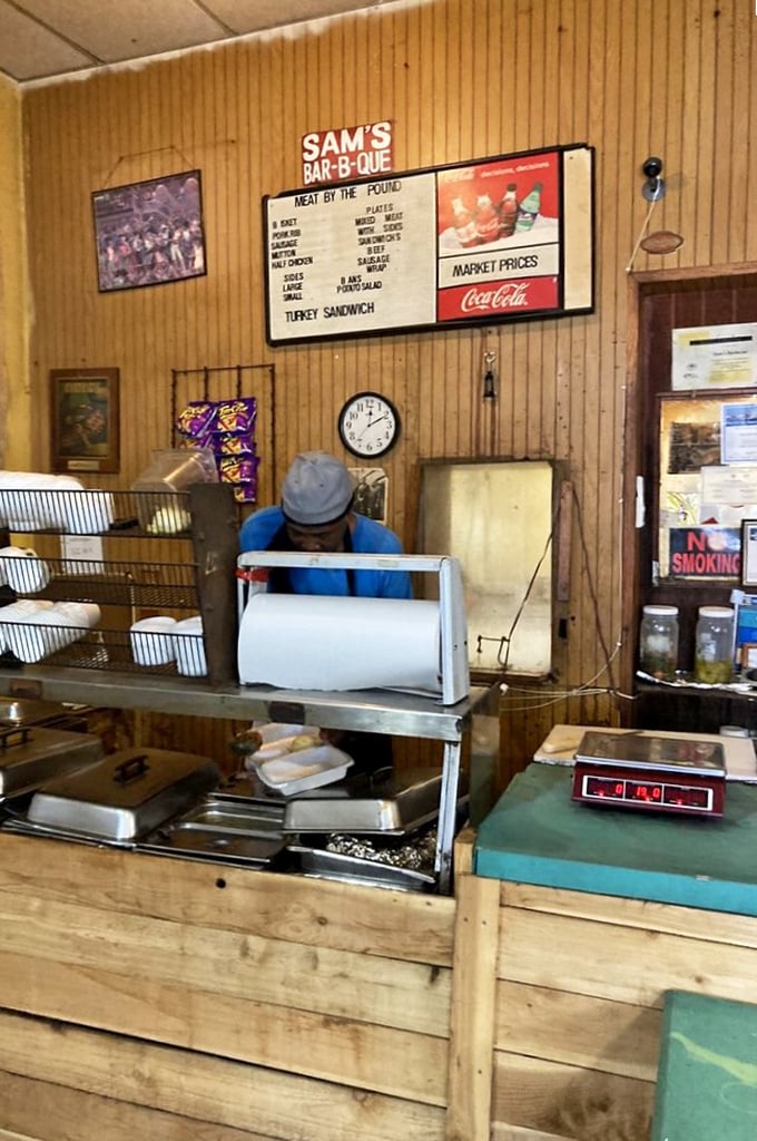 Behind every great barbecue joint is someone who understands that perfection takes patience. The counter at Sam's is where meat meets mastery.