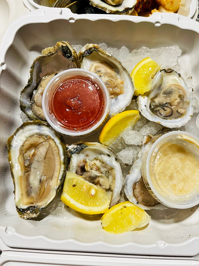 Fresh oysters on ice with bright lemon wedges&mdash;nature's perfect appetizer just waiting for a splash of cocktail sauce.