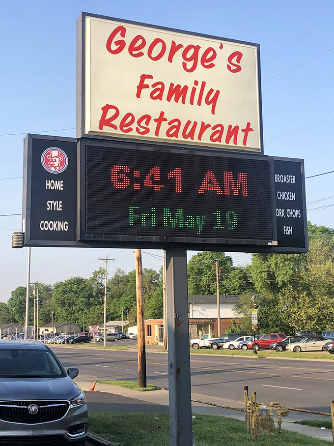 The roadside sign announces George's like an old friend, complete with opening time for early birds seeking their breakfast fix.
