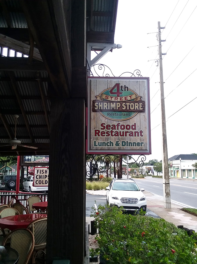 The sign that stops seafood seekers in their tracks. Not just a restaurant marker&mdash;it's a promise of "Lunch & Dinner" happiness hanging in the Florida sunshine.