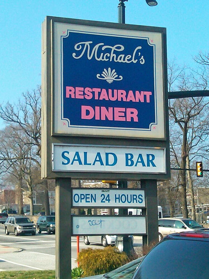 The vintage blue and red signage announces "OPEN 24 HOURS" like a promise to night shift workers and insomniacs everywhere. Some heroes wear aprons, not capes.