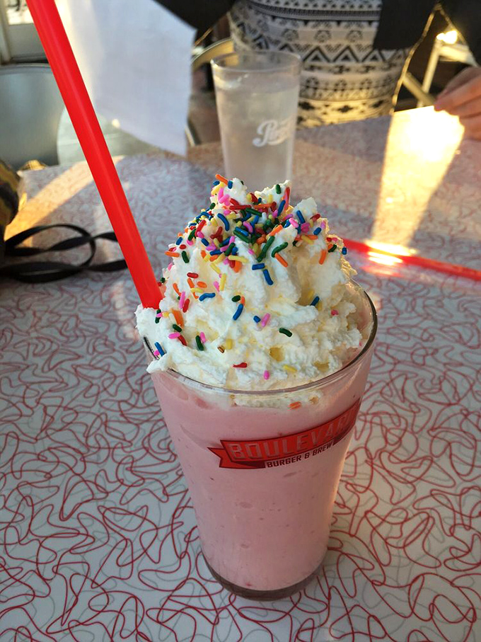 This strawberry milkshake wears its sprinkles like confetti at a celebration. Whipped cream mountain included at no extra charge!