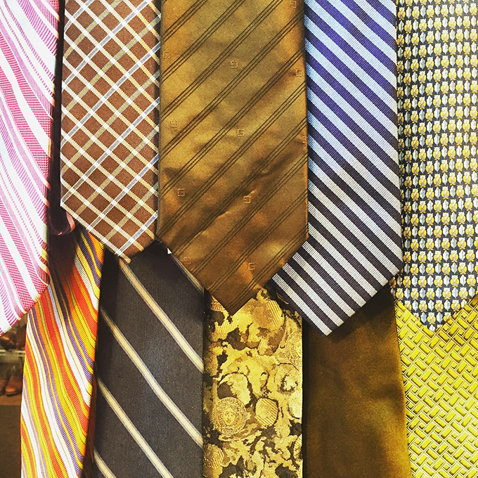 Neckties that tell tales of boardroom battles and champagne celebrations, now awaiting their next power lunch or wedding toast.