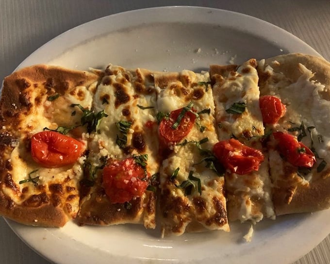 Flatbread that's having an identity crisis as a pizza, but we're not complaining. Those roasted tomatoes are basically a serving of vegetables, right?