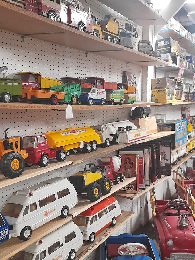 Vintage toy trucks line these shelves like a parade through decades of American childhood. Nostalgia on wheels!