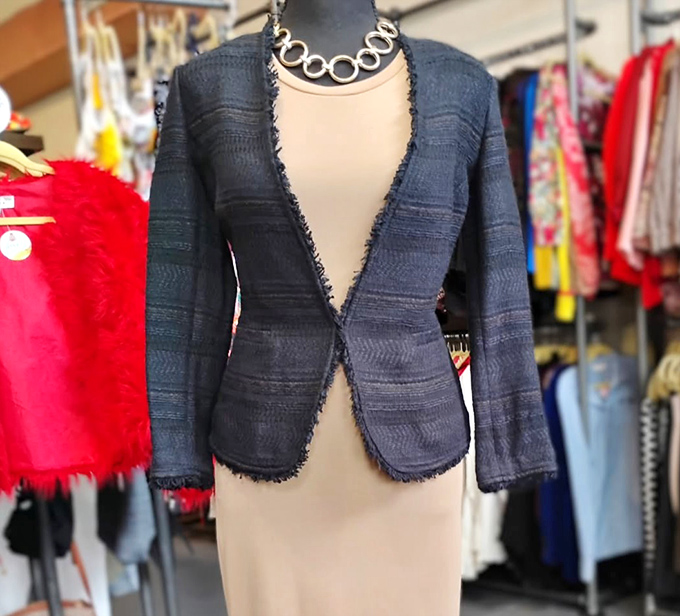 This textured navy jacket doesn't just complement an outfit—it completes it, like the perfect punchline to a well-crafted joke.