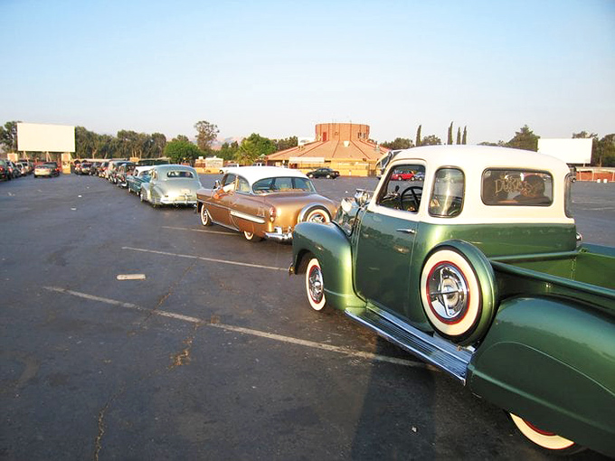 Classic cars line up for a special event, proving that vintage vehicles and outdoor movies create the perfect nostalgic cocktail.