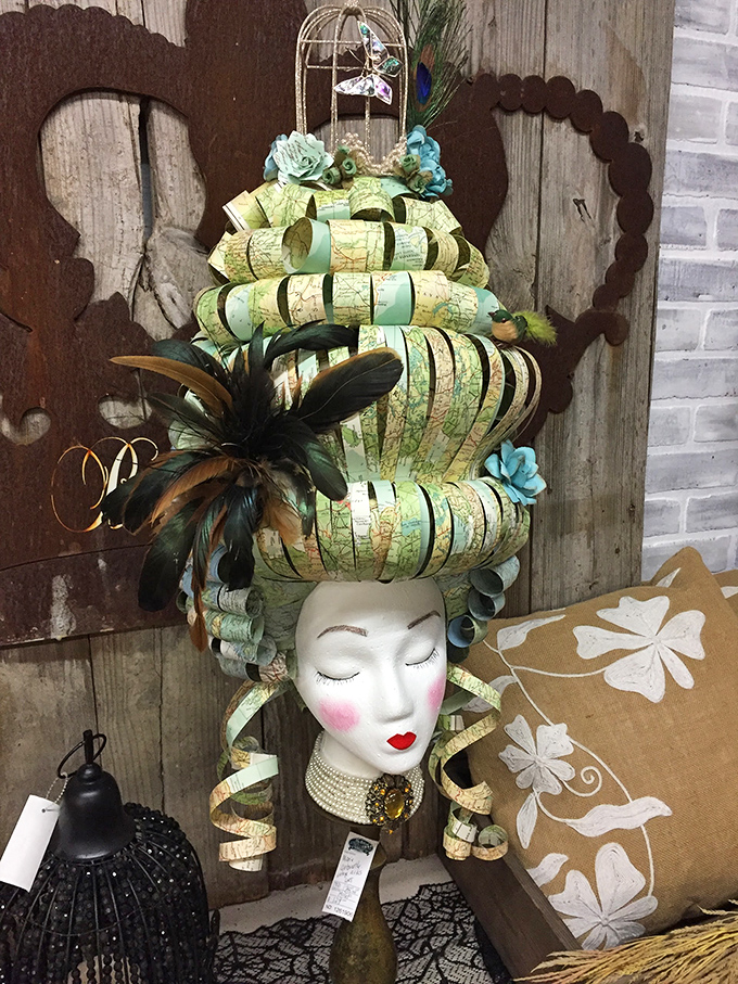 Not your average mannequin head &ndash; this theatrical creation with map-inspired styling would make any conversation piece jealous.