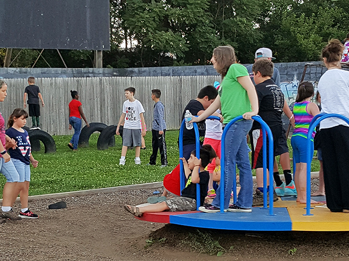 Young moviegoers making memories on the playground. In twenty years, they'll bring their own children to this same magical spot.
