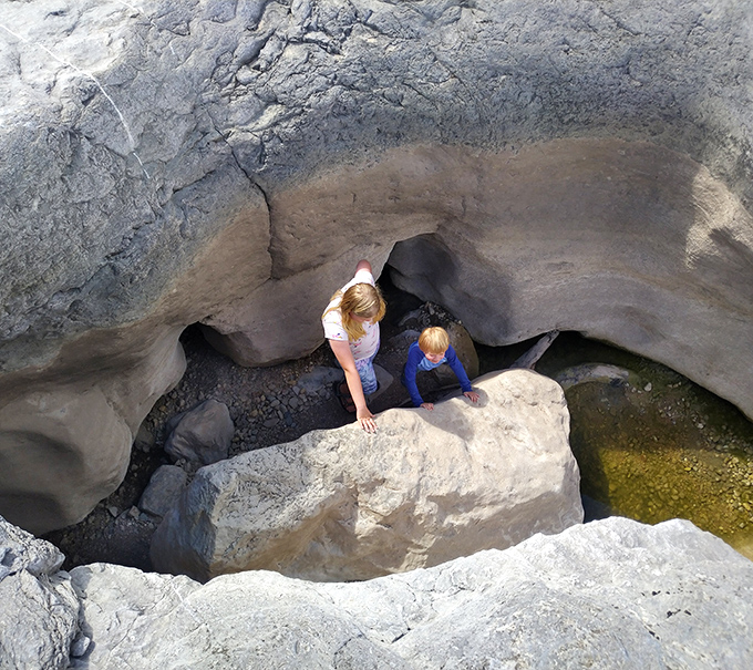 Hidden treasures await the curious explorer. This secluded pool, framed by cypress and limestone, feels like stepping into a secret world.