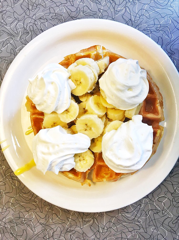 A Belgian waffle crowned with bananas and whipped cream&mdash;breakfast that boldly crosses the line into dessert territory without apology.