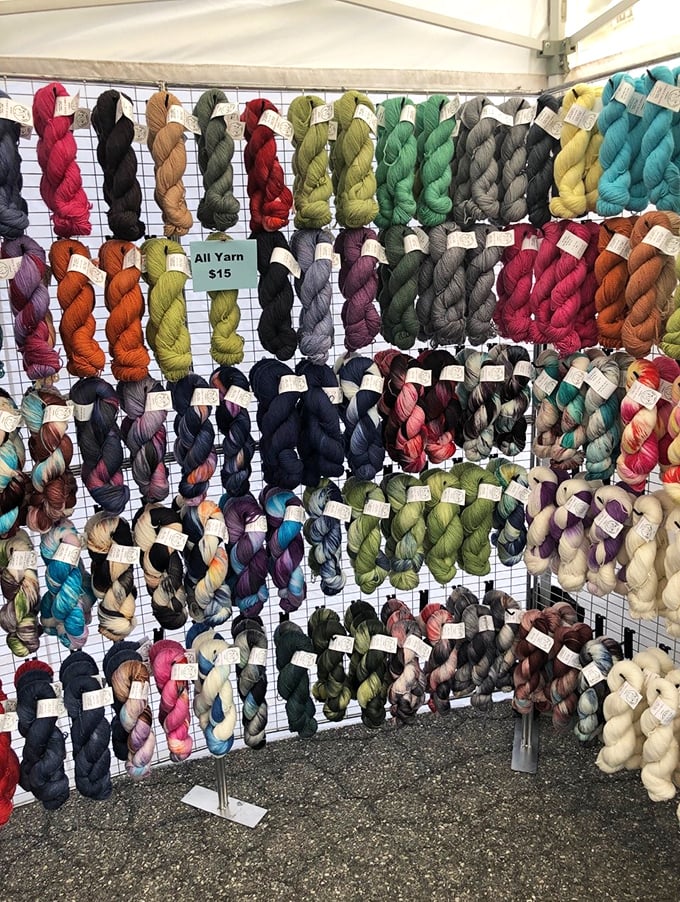 A fiber artist's dream in every hue imaginable. These skeins aren't just yarn—they're future scarves, sweaters, and excuses to ignore housework.
