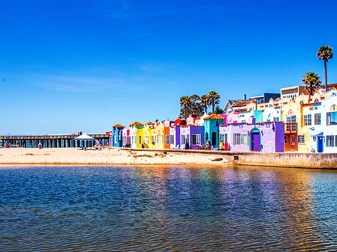Capitola's rainbow houses reflect pure joy in the sparkling waters of Monterey Bay.