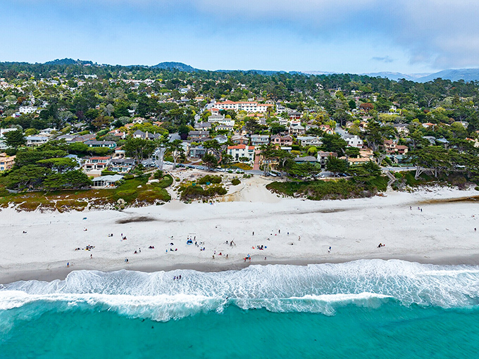 Carmel's storybook cottages cascade toward white sand beaches where cypress trees frame some of California's most photographed coastal views.