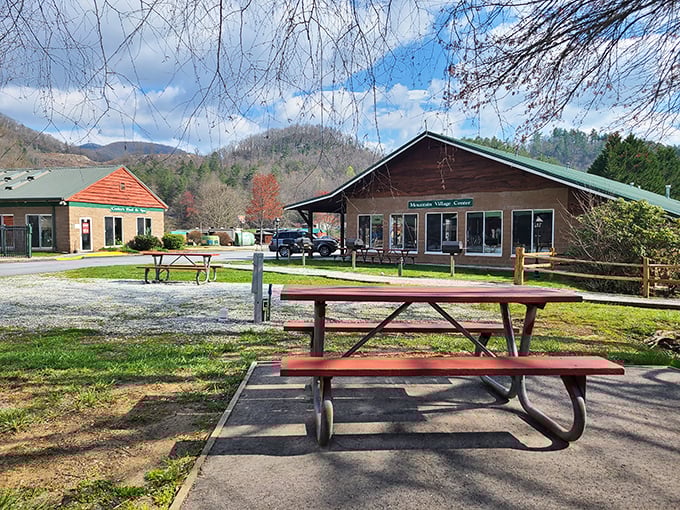 Mountain village center with picnic tables waiting for visitors &ndash; small-town charm that big cities try desperately to recreate.