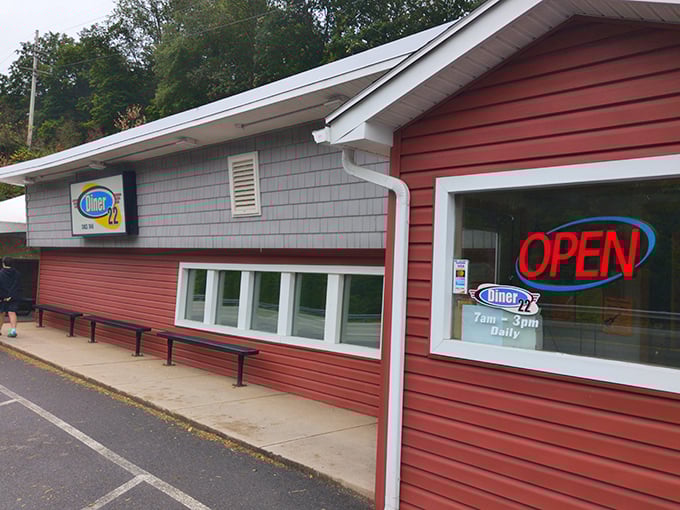 Classic roadside diner wearing its years like badges of honor, each one representing satisfied breakfast customers.