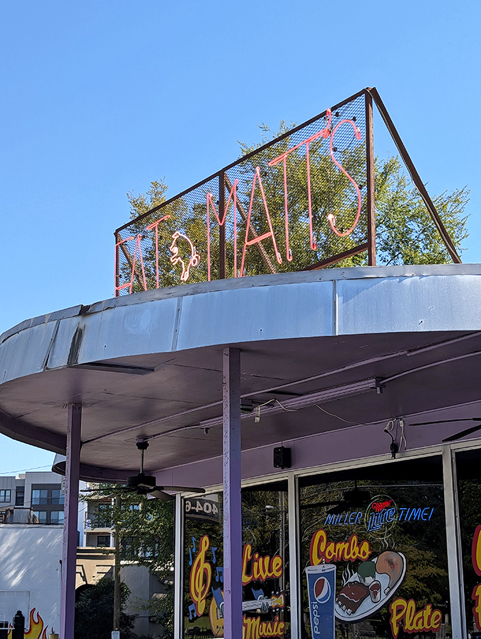 Neon lights and retro vibes create the perfect backdrop for live music and legendary ribs.