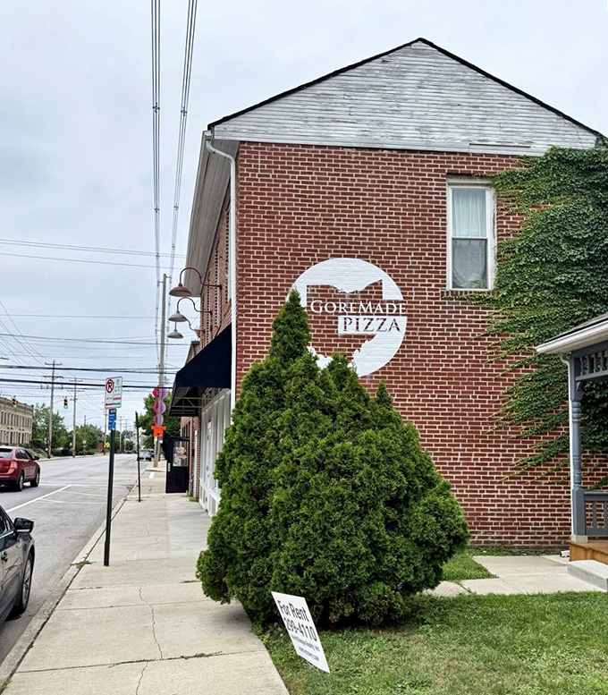 Columbus neighborhoods hide gems like this, where brick walls hold decades of pizza-making secrets and traditions.