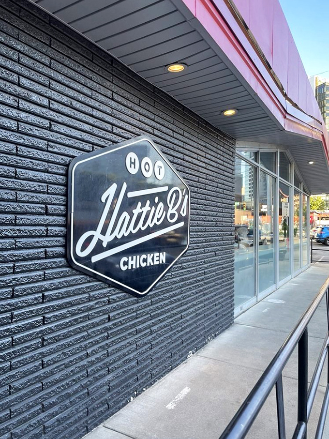 Hattie B's sleek black facade promises hot chicken with style - where tradition meets Instagram-worthy presentation perfectly.