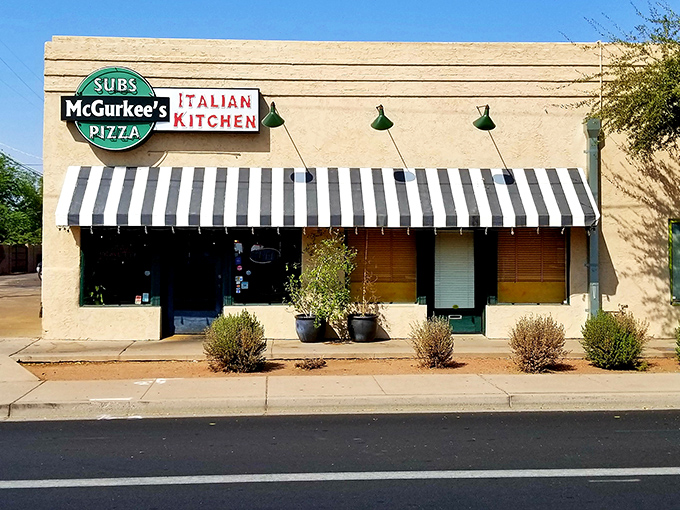 Classic striped awning signals traditional submarine sandwich excellence - some things never need updating or improvement.
