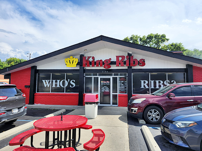 Bold red and black signage asking "Who's Ribs?" - a question that gets answered deliciously with every single tender bite.
