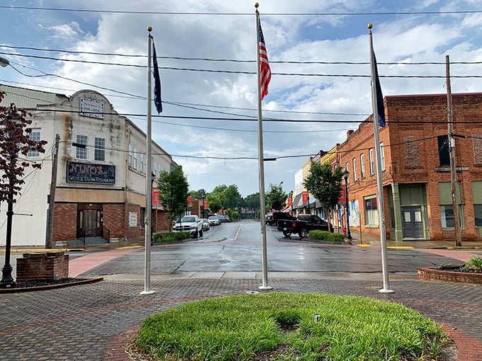 Mountain town squares where flags flutter proudly and community spirit runs deeper than roots.