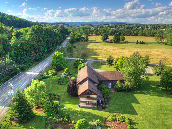 Rolling hills and country roads lead to this historic log cabin – Pennsylvania's countryside at its most picturesque.