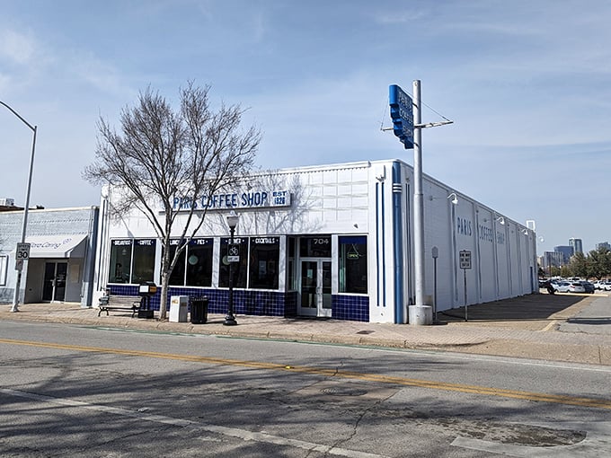 Paris Coffee Shop's pristine white exterior and blue trim look like they stepped out of a perfect diner postcard.