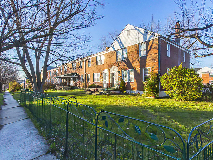 Parkville's brick rowhouses stand shoulder-to-shoulder, a testament to communities where neighbors become family and porches become social clubs.