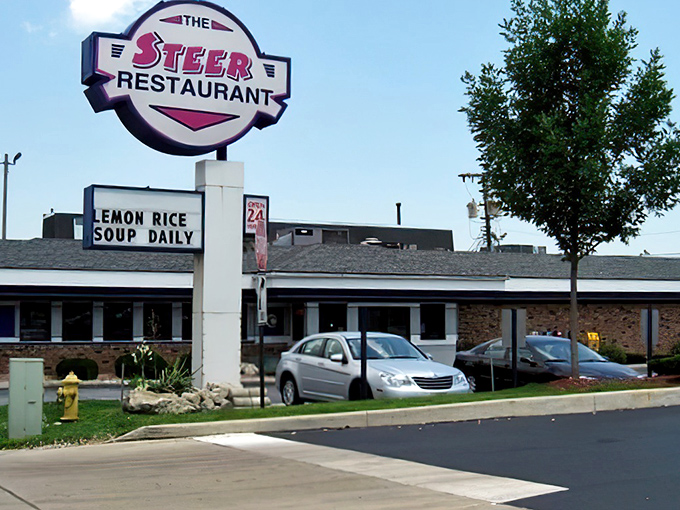 The Purple Steer's retro sign promises steaks and memories from a simpler dining era.