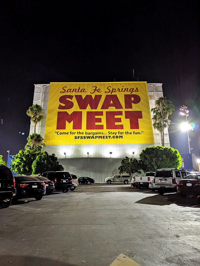 The giant yellow sign beckons like a beacon for treasure hunters seeking seven-day shopping adventures.