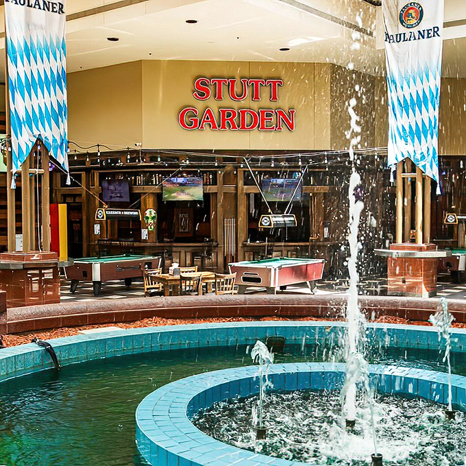 Stuttgarden's fountain creates a European moment in Texas City - Bavarian flags fluttering above a gathering place for all.