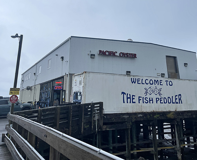 "WELCOME TO THE FISH PEDDLER" isn't just a sign&mdash;it's an invitation to seafood paradise. Those stilts mean you're practically dining on the water.