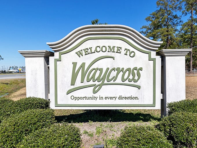 The distinctive "Welcome to Waycross" sign greets visitors with its unique wavy design, promising "opportunity in every direction" and budget-friendly experiences.