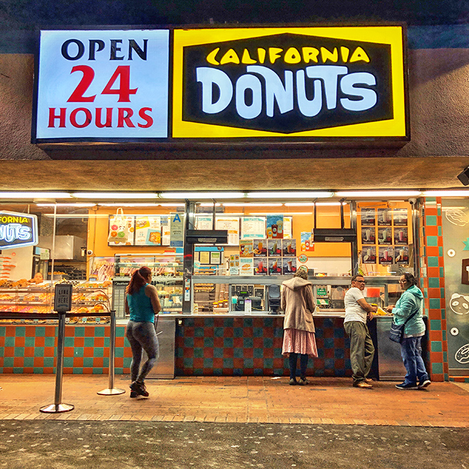California Donuts' bright yellow facade promises sunshine in every bite, no matter the hour.