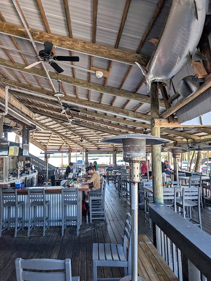 Blue umbrellas, blue water, blue skies - it's like dining inside a Winslow Homer painting, only with better mojitos. 