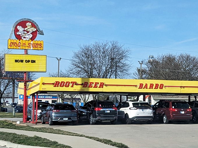 The classic yellow canopy of Dog n Suds has sheltered generations of hungry drivers. This drive-in time machine serves nostalgia with a side of fries.
