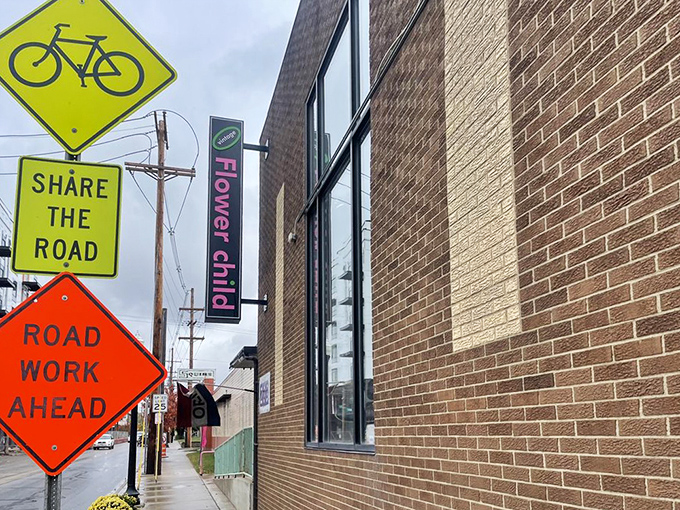 Even on a rainy day, Flower Child's vibrant signage cuts through the gloom, promising a psychedelic shopping experience inside.