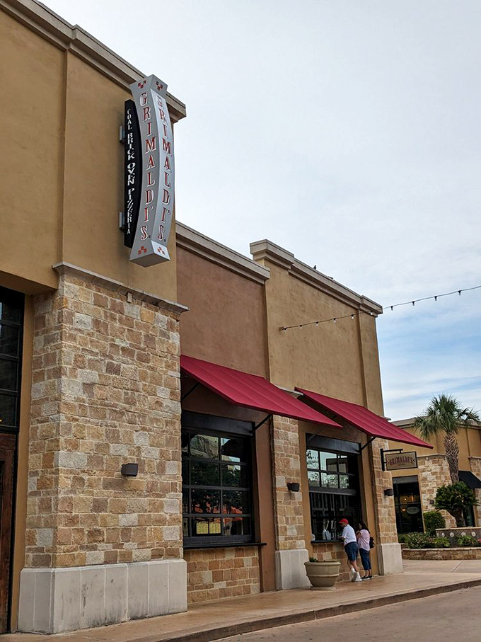 Stone and brick architecture hints at the traditional coal-fired magic happening inside.