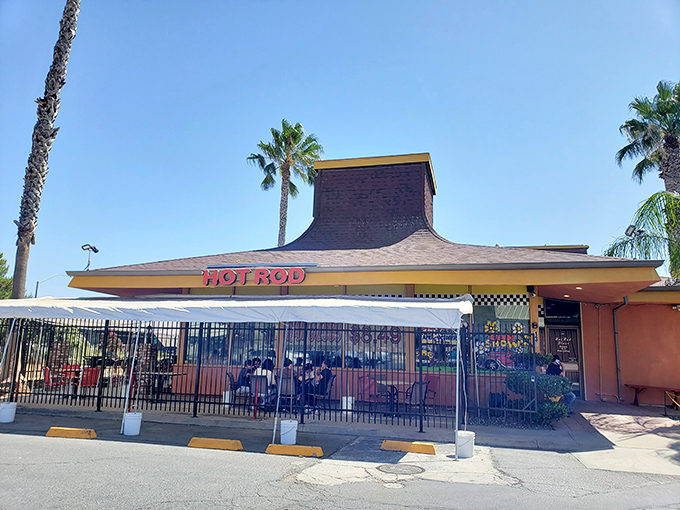 Classic car culture meets classic breakfast comfort in this perfectly themed automotive paradise.