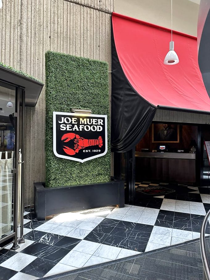 Joe Muer Seafood&rsquo;s sleek entryway, framed by lush greenery and bold design, sets the stage for a dining experience where every plate feels like a toast to tradition.