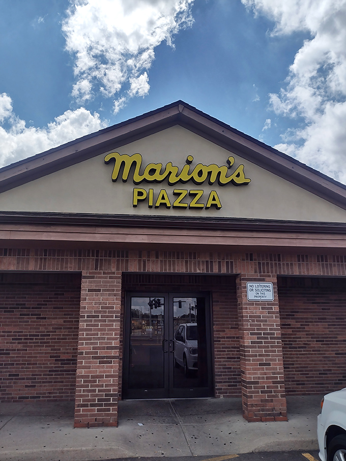 This timeless facade has probably welcomed three generations of families seeking their perfect pizza slice.