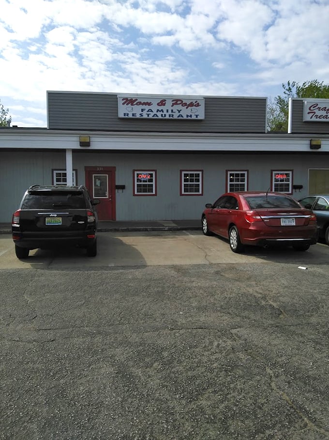 Multiple "Open" signs suggest eager hospitality, while the modest facade promises honest, hearty home-style cooking.